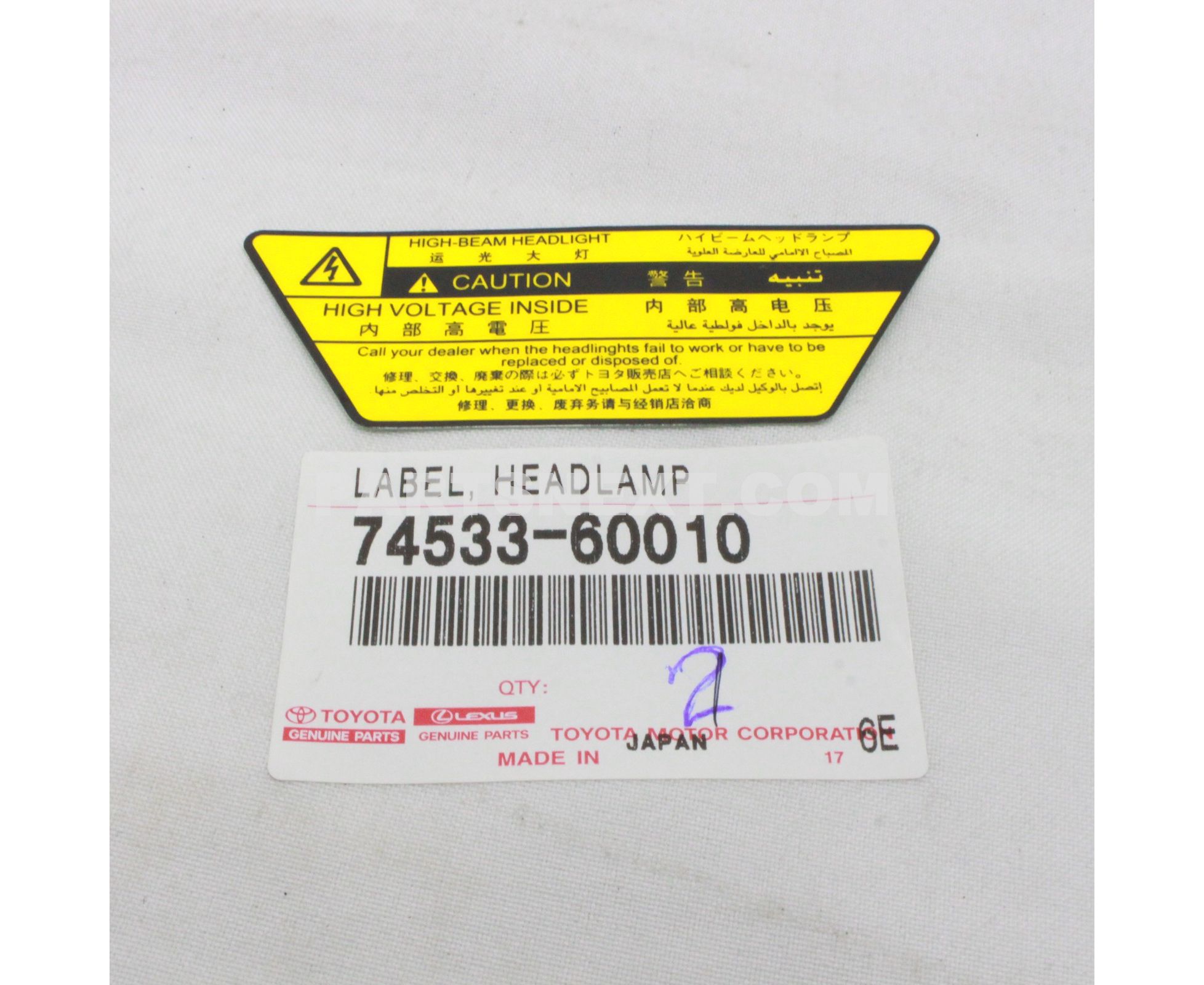Toyota :: 74533-60010 LABEL, HEADLAMP VOLTAGE CAUTION